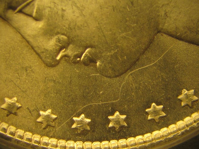 Scratches vary in severity on coins - Numismatic News
